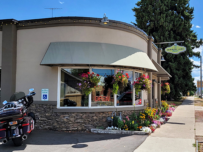 The curved stone facade and vibrant hanging flower baskets make Mirror Lake Diner the most inviting pit stop on your Uinta Mountains adventure.