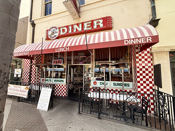 Classic Americana beckons with that iconic red and white awning. The checkerboard pattern practically whispers, "Good food happens here!"