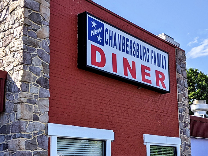 The iconic red brick exterior of Chambersburg Family Diner, where Pennsylvania comfort food traditions have been keeping locals happy for generations.