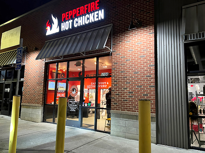 The fiery red signage of Pepperfire beckons like a beacon in the night, promising Nashville's most delicious form of culinary punishment.