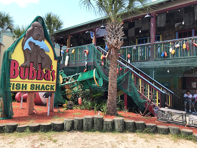 That iconic manatee mascot clutching a fish tells you everything &ndash; this isn't fancy dining, it's seafood paradise wrapped in weathered wood and coastal charm.