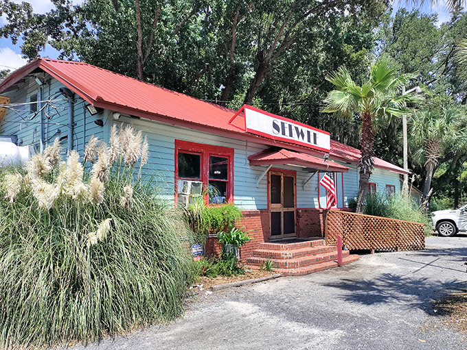 The pale blue exterior with its iconic red trim stands like a culinary lighthouse, beckoning hungry travelers to drop anchor and feast.