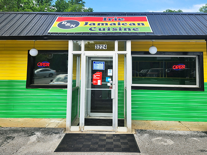 The vibrant yellow and green exterior of R&N Irie Jamaican Cuisine stands out like a tropical bird that flew north and decided to nest in Chattanooga.
