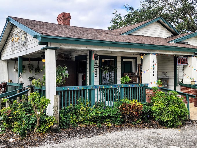 Old Florida charm at its finest! This weathered white cottage with teal trim might not look fancy, but inside awaits seafood paradise that locals have treasured for years.