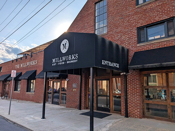 The brick facade of The Millworks stands like a culinary fortress in Harrisburg's Midtown, promising delicious adventures behind those unassuming doors.