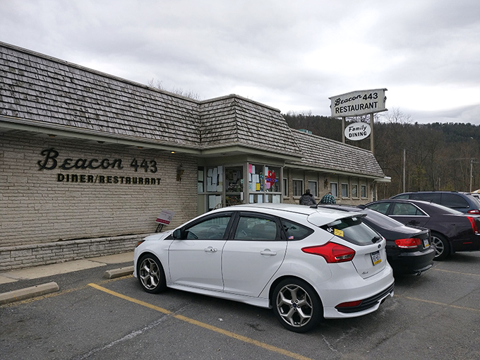 The classic roadside sign of Beacon 443 stands like a culinary lighthouse, guiding hungry travelers to a haven of comfort food in Lehighton.