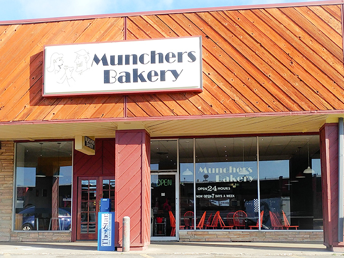 The warm wooden exterior and inviting signage promise fresh-baked happiness waiting just beyond those doors.