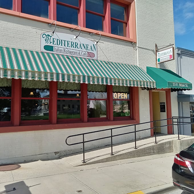 The classic green and white awning of Mediterranean Restaurant beckons like an old friend, promising authentic Italian flavors in downtown Wilmington.