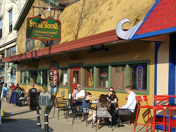 The cheerful yellow exterior of The Steak House in Wellsboro invites you in like a warm hug, complete with outdoor seating for people-watching between bites.