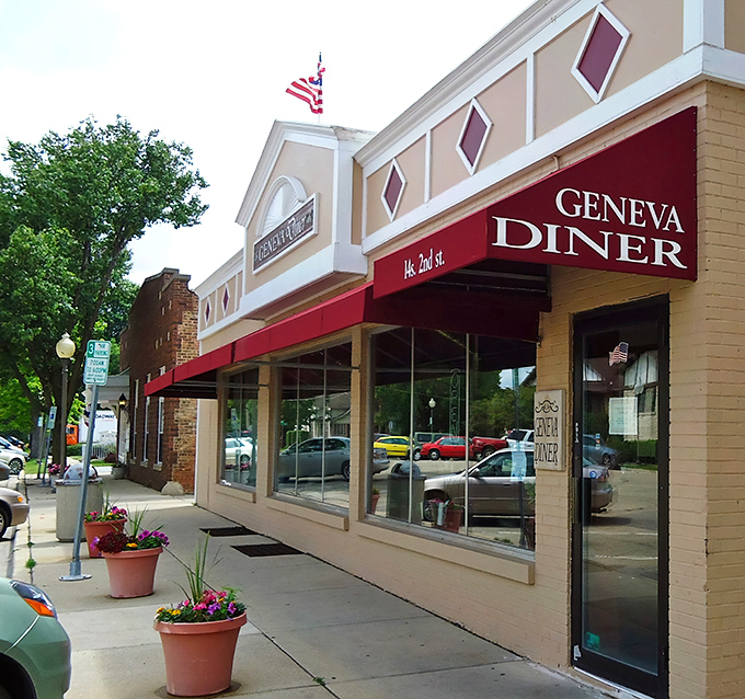 The iconic red awning of Geneva Diner stands as a beacon for breakfast lovers on 2nd Street, promising comfort food without the fanfare.