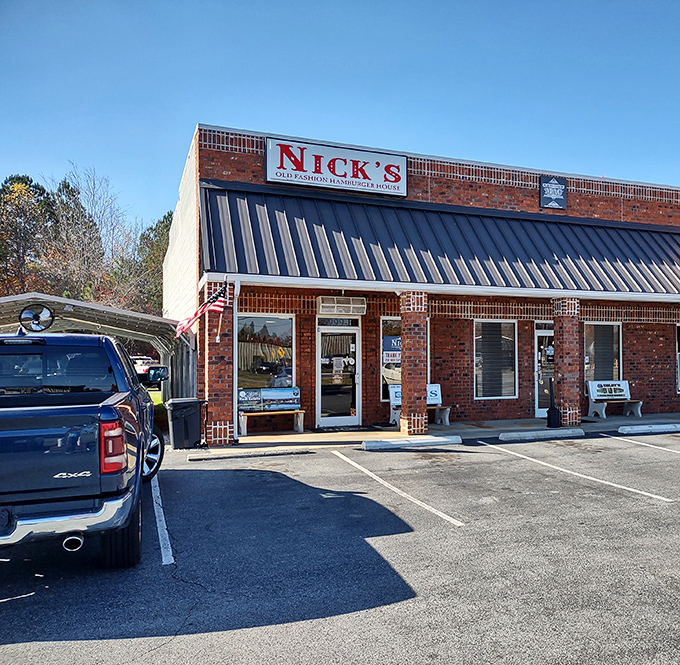 The unassuming brick exterior of Nick's Old Fashion Hamburger House in Lexington hides culinary treasures that locals have been quietly enjoying for years.
