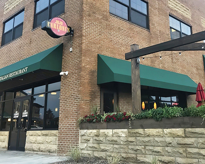The corner entrance with its circular sign serves as a beacon for hungry travelers &ndash; a culinary lighthouse guiding pasta pilgrims home.