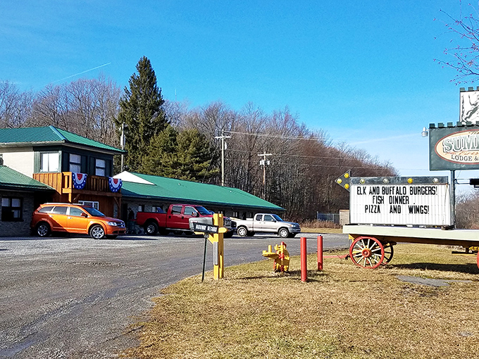 The Summit Lodge & Grill welcomes hungry travelers with its rustic charm and roadside sign promising elk burgers, fish dinners, pizza, and wings&mdash;Pennsylvania comfort at its