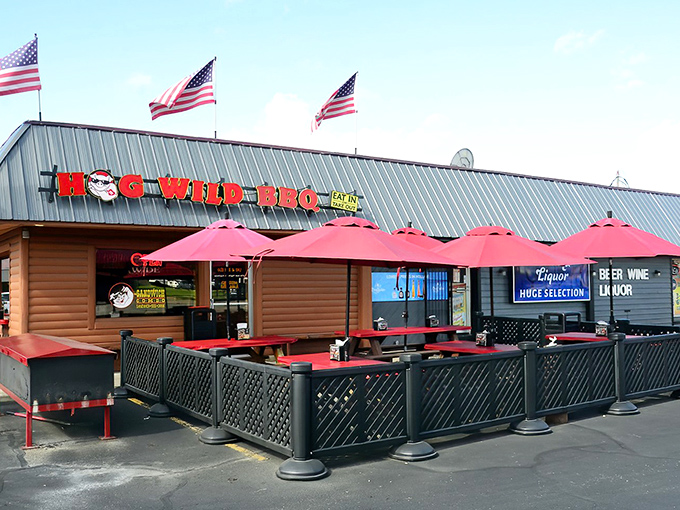 American flags flutter above this barbecue sanctuary like beacons guiding hungry pilgrims to the promised land of smoked meats and outdoor dining.
