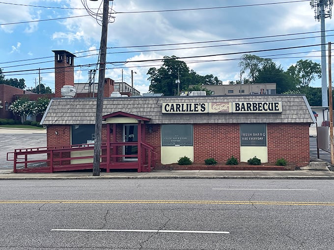 The unassuming brick exterior of Carlile's Barbecue stands like a time capsule on Birmingham's 6th Avenue South, promising smoky treasures within.