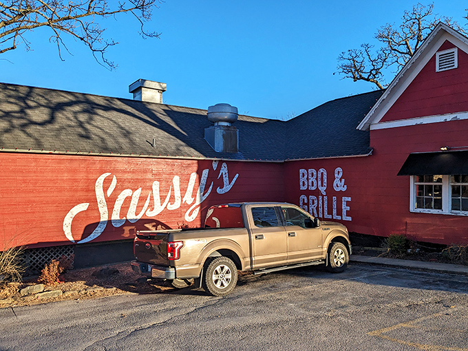 The bold red siding and classic "BBQ & GRILLE" signage announce exactly what you're in for: no pretense, just serious barbecue business.