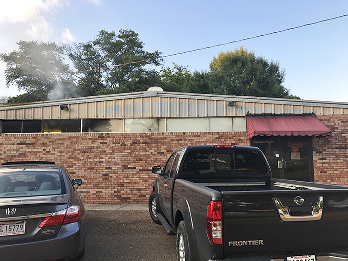 That red awning is your beacon to barbecue bliss, guiding hungry travelers like a smoky North Star.