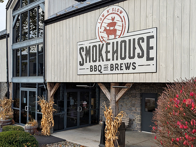 The iconic "Low N' Slow" sign welcomes hungry travelers to Smokehouse BBQ & Brews, where carnivorous dreams come true in Bird-in-Hand.