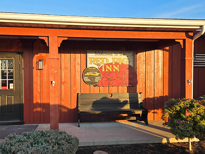 That cheerful pig on the sign knows something you don't: inside awaits barbecue worth celebrating.