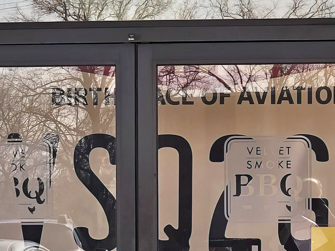 That modest storefront holds some serious BBQ secrets, like a delicious spy operation hiding in plain sight.