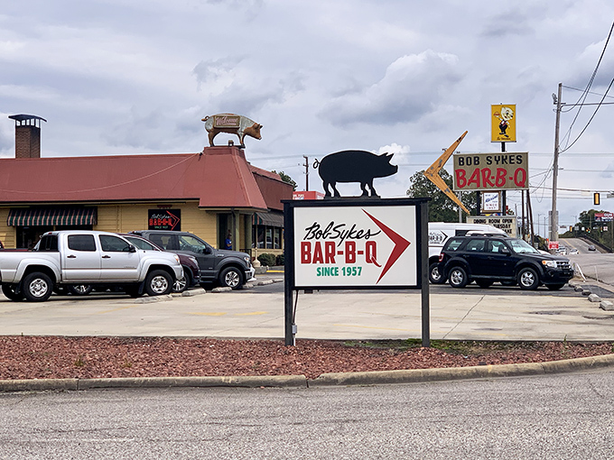 The sign says it all: "Bob Sykes BAR-B-Q Since 1957." Six decades of smoke-kissed perfection that's worth every mile of your journey.