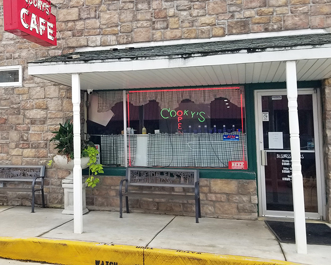 Checkered curtains and a welcoming porch create that "come on in" vibe that's becoming rarer than a well-done steak at a chef's table.