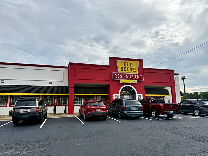 The bright red facade of Old South Restaurant stands out like a beacon for hungry travelers, promising comfort food treasures within.