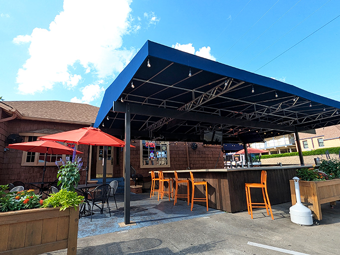 The blue-awninged outdoor patio at Momma Goldberg's isn't just seating—it's Auburn's unofficial living room where sandwich dreams come true.