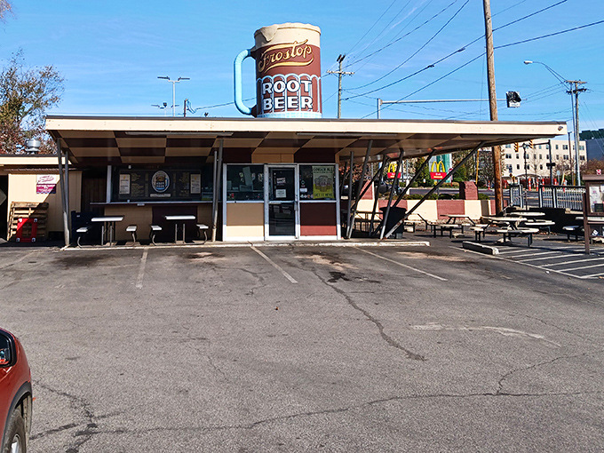 Morning sunshine bathes Frostop's classic drive-in architecture, where time seems to have paused somewhere between Elvis and the moon landing.