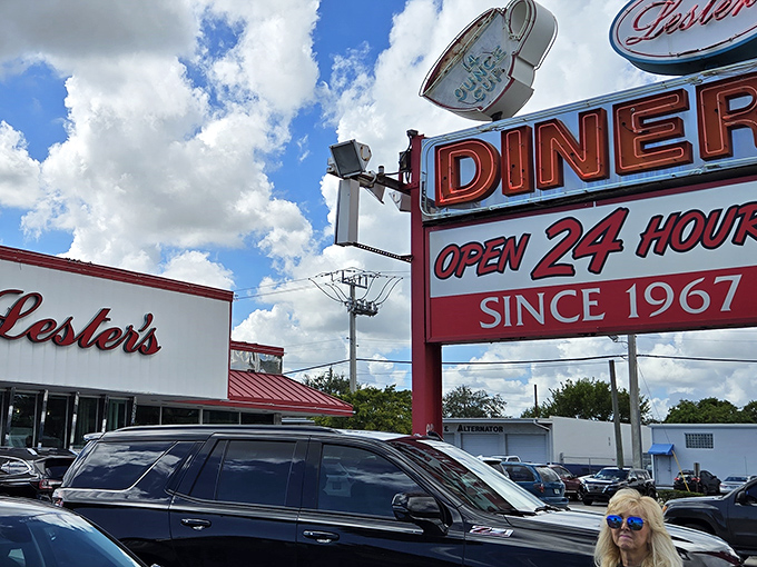 That iconic neon sign beckons like an old friend, promising comfort food and conversations that flow as freely as the coffee.