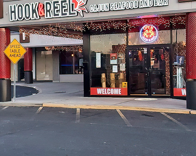 The entrance to seafood paradise doesn't need a golden gate. Hook & Reel's welcoming storefront promises Cajun treasures within those twinkling lights. 