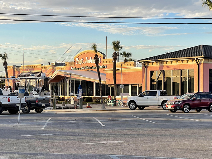 The coral-pink palace of seafood stands proudly, cars lined up outside like eager dinner guests waiting for their table.