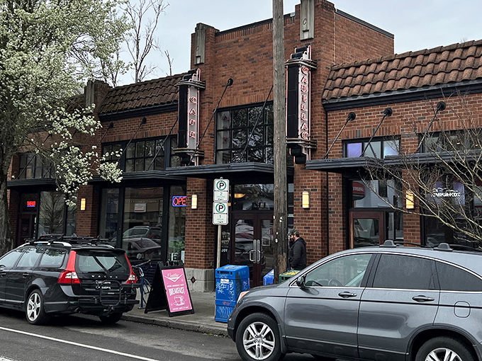 The brick exterior of Cadillac Caf&eacute; stands like a culinary lighthouse on Northeast Broadway, beckoning hungry Portlanders with its vintage charm.