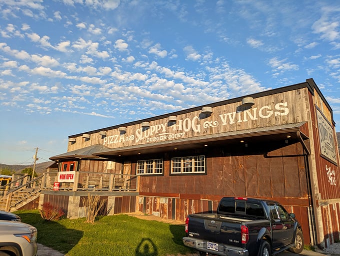 The rustic wooden exterior of Sloppy Hog catches the golden hour light, making even its weathered boards look like they're telling delicious secrets.