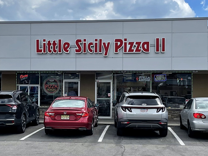 The unassuming storefront of Little Sicily Pizza II might not scream "food paradise," but locals know better than to judge this culinary gem by its cover.