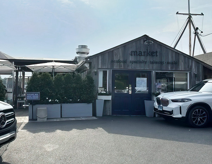 The weathered gray shingles and navy blue doors of Rowayton's market aren't just charming&mdash;they're a promise that seafood authenticity awaits inside.