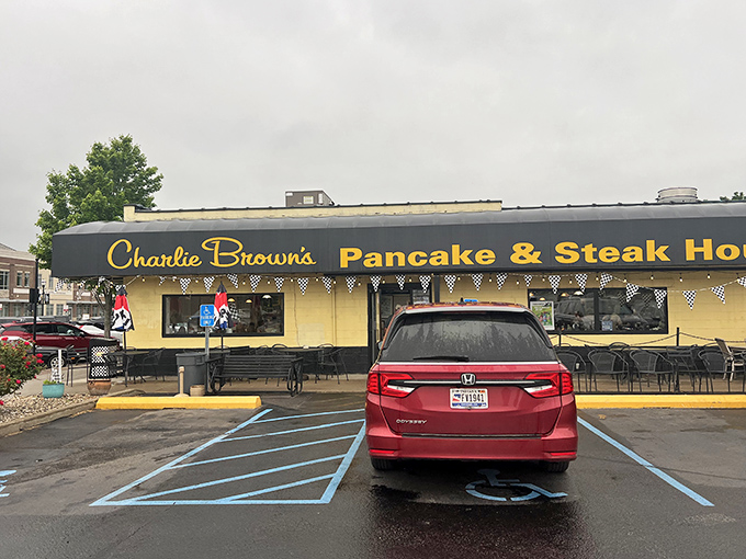 The yellow exterior with its bold black awning stands like a beacon of breakfast hope on Indianapolis's northeast side. Charlie Browns promises comfort before you even walk through the door.