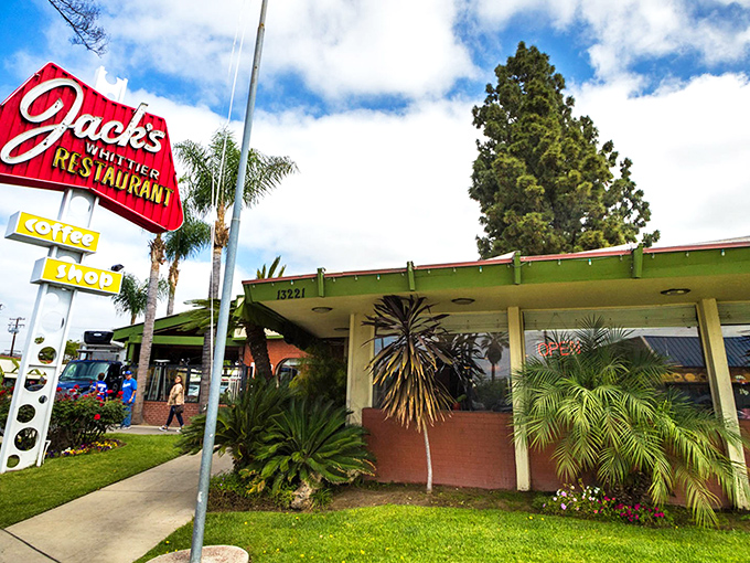 The red iconic sign of Jack's beckons hungry travelers like a lighthouse for comfort food enthusiasts. Classic Americana at its finest.