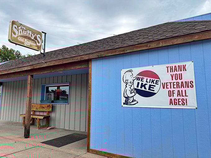 The unassuming exterior of Joe Snuffy's, with its bright blue wall and Eisenhower tribute, proves great food often hides in plain sight.