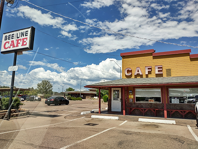 The sunshine-yellow exterior of Beeline Cafe stands out like a beacon of breakfast hope on Payson's main drag, promising comfort food salvation to hungry travelers.