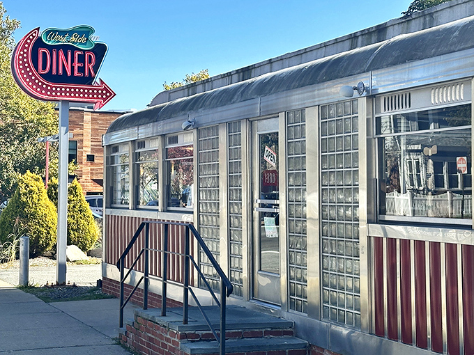 The iconic neon sign beckons hungry travelers like a lighthouse guiding ships through foggy Rhode Island mornings. Classic Americana at its finest.