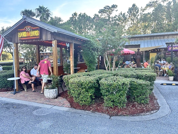 Daylight reveals the charming entrance where locals patiently wait their turn, knowing that paradise comes to those willing to linger under the Florida pines.