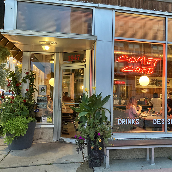 The iconic red neon sign of Comet Cafe glows like a beacon for hungry Milwaukeeans, promising comfort food that's truly out of this world.