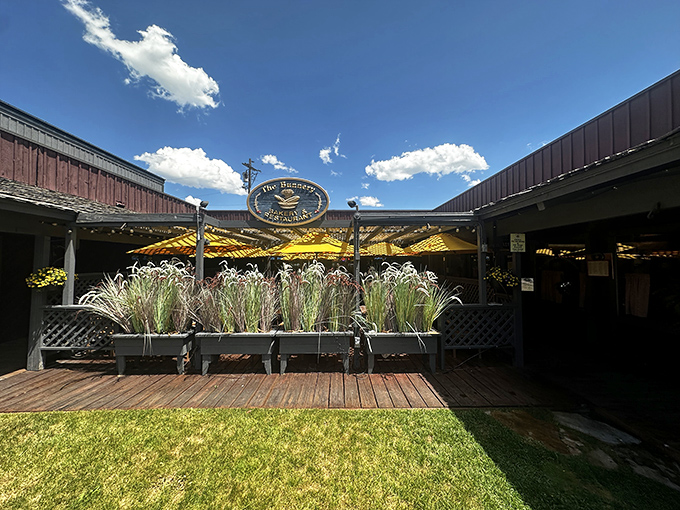 That iconic sign beckoning you toward breakfast glory, with the Tetons standing guard like nature's approval stamp.