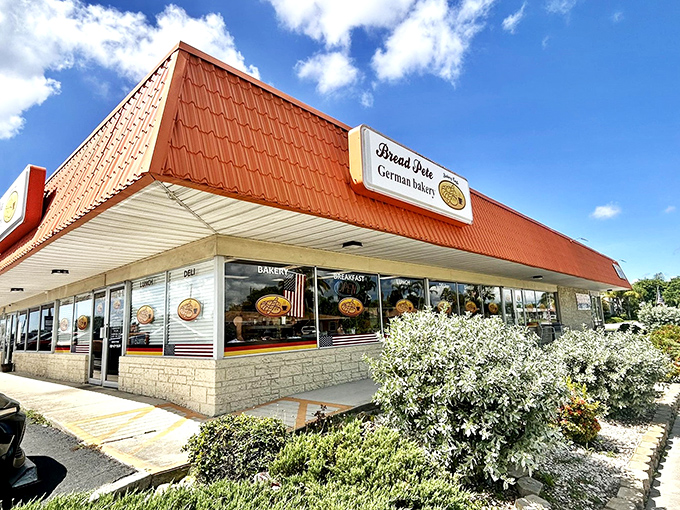 The bright orange roof of Bread Pete stands out like a culinary lighthouse, beckoning carb enthusiasts to this unassuming strip mall treasure in Cape Coral.
