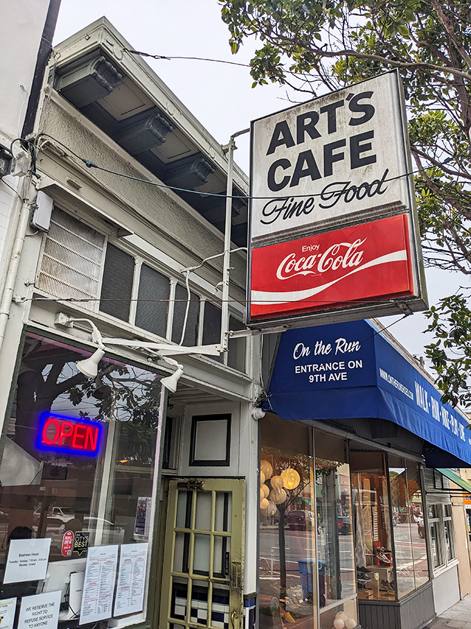 The classic neon "OPEN" sign beckons like an old friend. Art's Cafe's vintage storefront promises authentic diner magic in San Francisco's Inner Sunset.