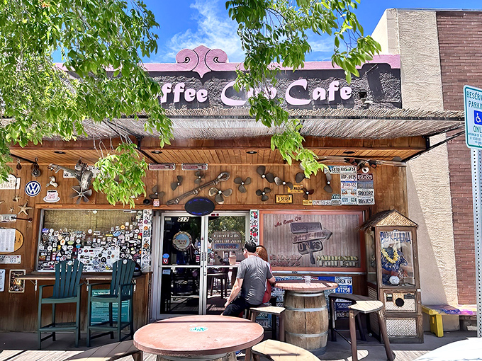 The iconic exterior of The Coffee Cup Cafe, where rustic charm and sticker-covered walls welcome hungry visitors to Boulder City's breakfast haven.