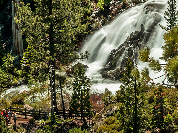 Nature's own silk curtain cascades over ancient granite, creating a hypnotic display that makes even the most jaded hikers stop in their tracks.