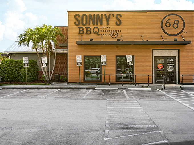 The wooden fa&ccedil;ade of Sonny's BBQ stands like a beacon of smoky promise against the Florida sky, beckoning hungry travelers with its simple, rustic charm.