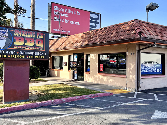 The unassuming exterior of Smoking Pig BBQ hides a flavor powerhouse inside—where smoky magic and Southern comfort join forces for one unforgettable feast.